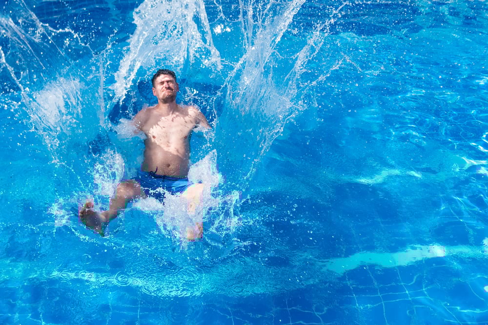 Why Does Water Feel Like Concrete When You Belly Flop Into It? » ScienceABC